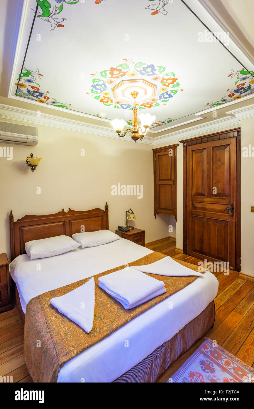 Traditional hotel room with painted ceiling Stock Photo - Alamy