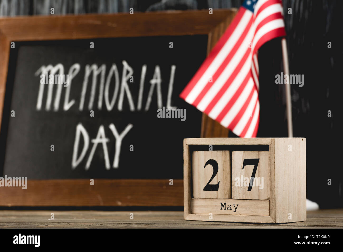 wooden cubes with date near chalkboard with memorial day lettering and ... wooden cubes with date near chalkboard with memorial day lettering and ...