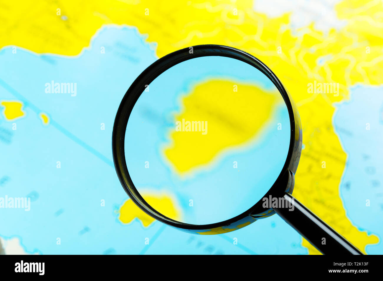 Magnifying glass and map Stock Photo - Alamy