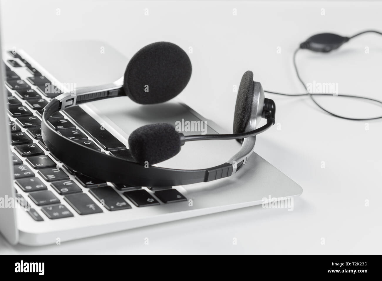 call center support concept. headset on keyboard computer laptop Stock ...