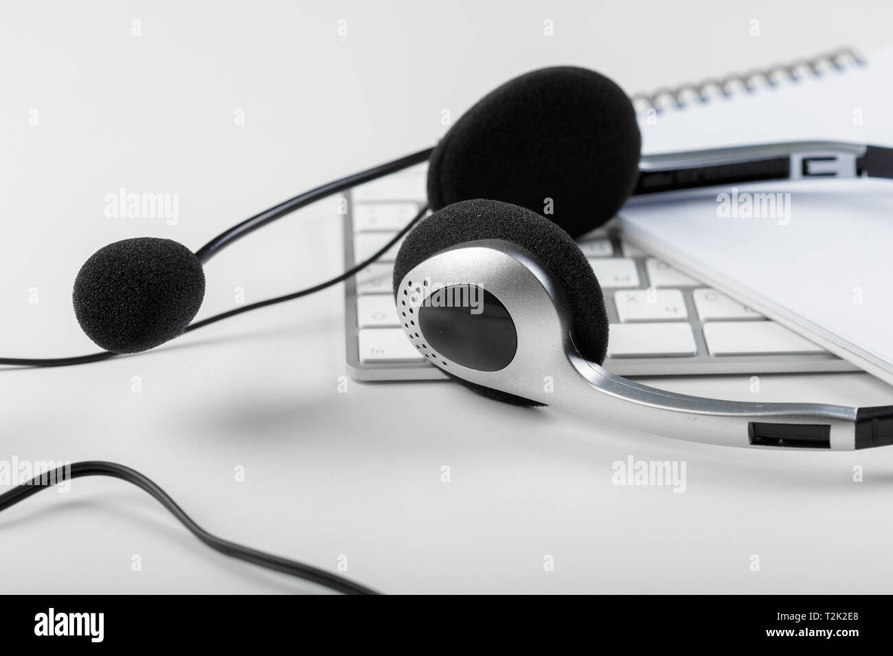 headset on keyboard computer laptop Stock Photo - Alamy
