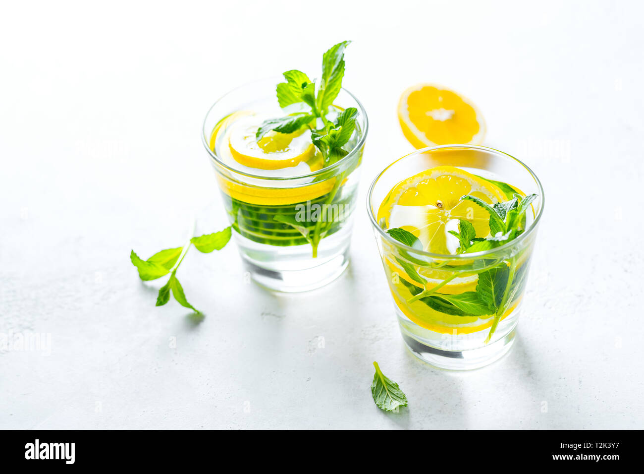 Infused water in glasses on white background. Healthy food drink ...
