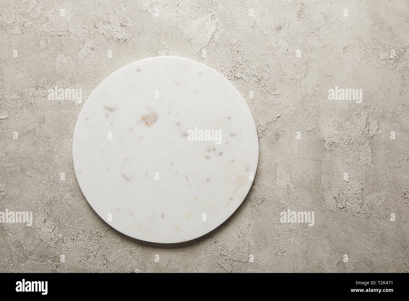 Top view of round marble tray on textured surface Stock Photo - Alamy