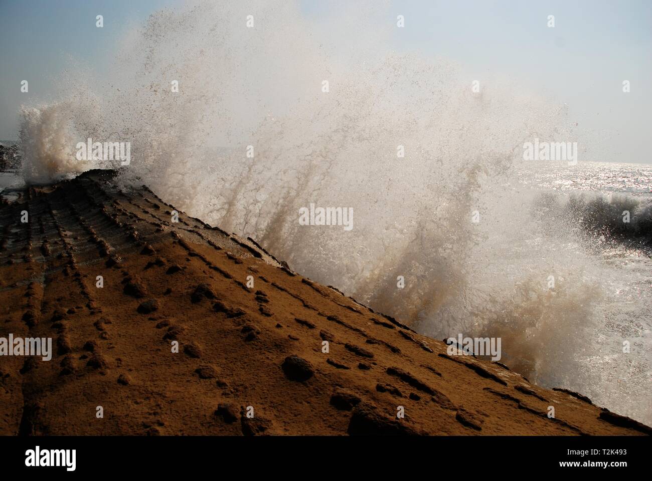 Ocean water crash to the rocks at beach and rise up in the air Stock ...