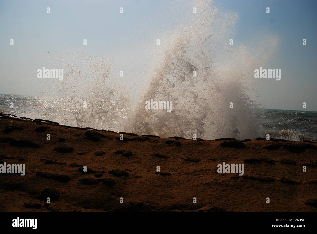Ocean water crash to the rocks at beach and rise up in the air Stock ...