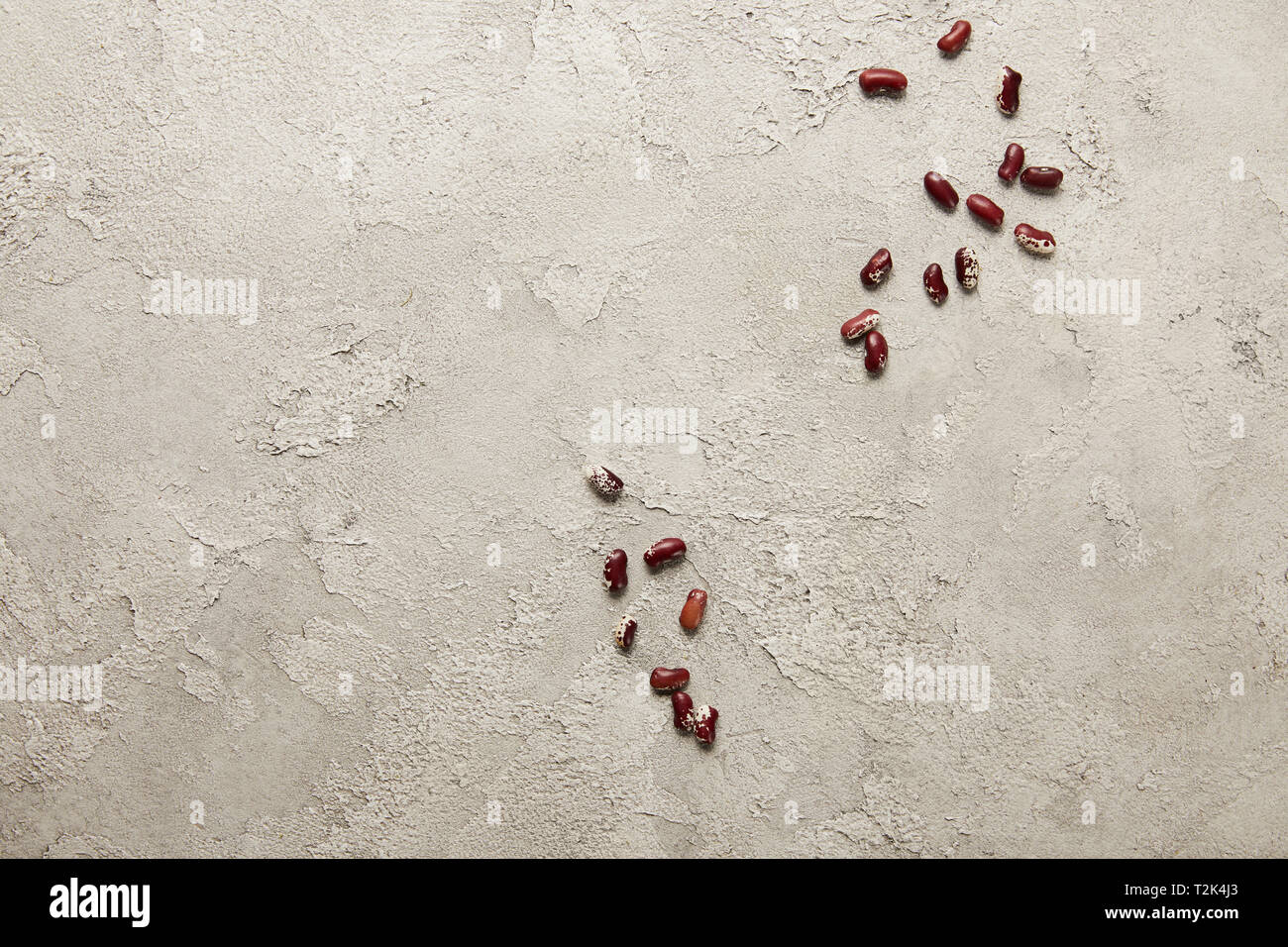 Top view of red beans on grey textured surface Stock Photo - Alamy