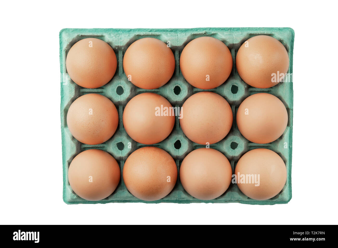 Twelve chicken eggs in paper packaging close-up. Isolated on white ...