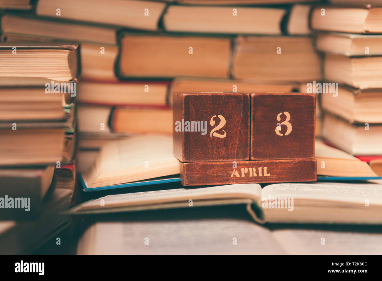 wooden calendar on the background of books, world book day Stock Photo ...