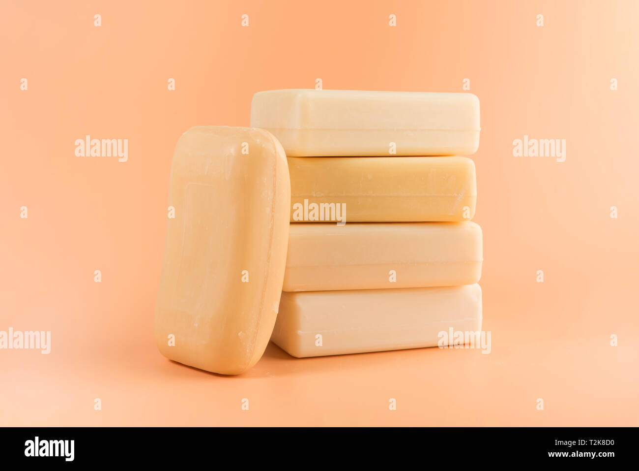 pieces of natural soap isolated on the orange background Stock Photo ...