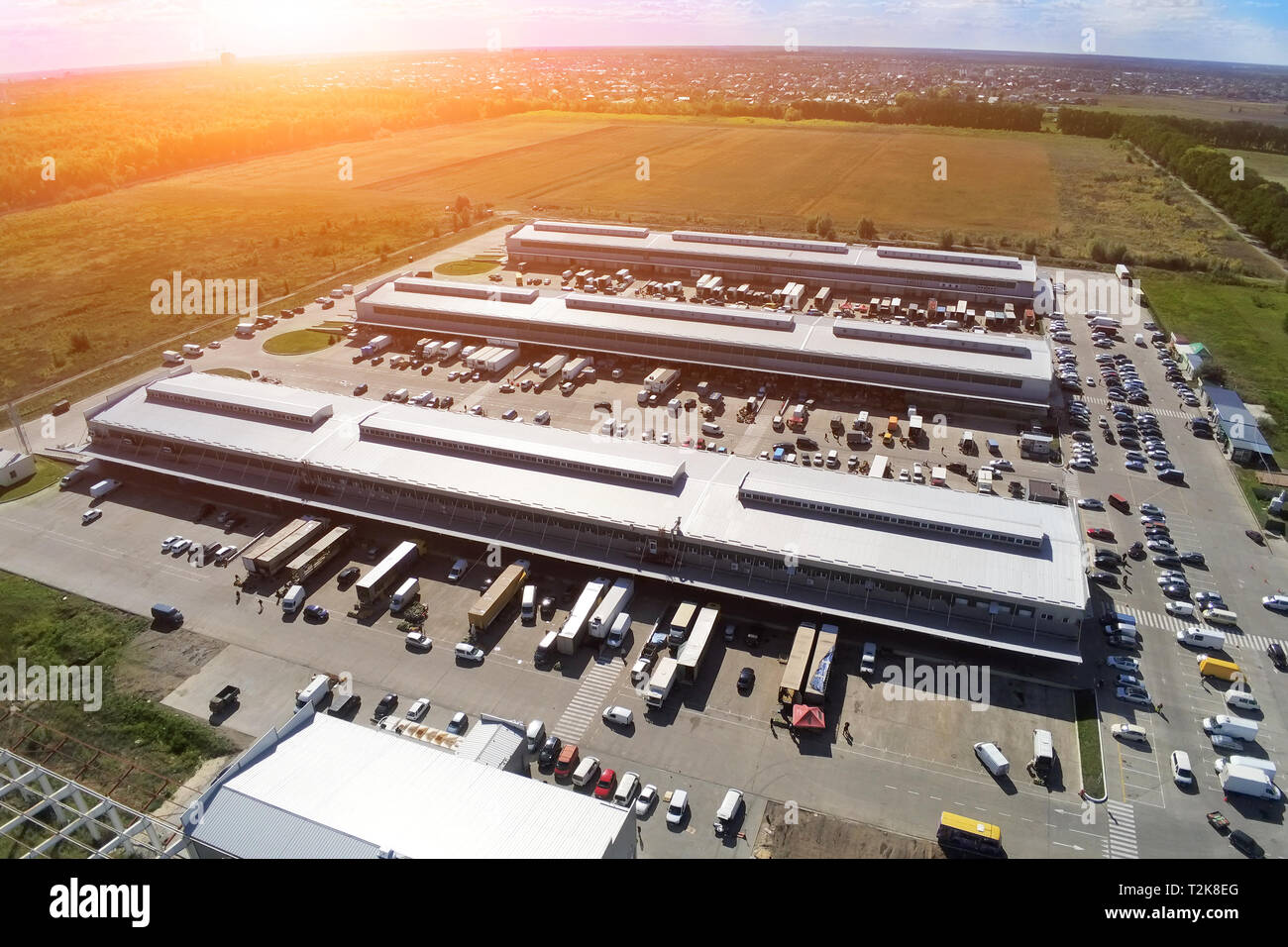 Aerial drone view of group of large modern industrial warehouse or ...