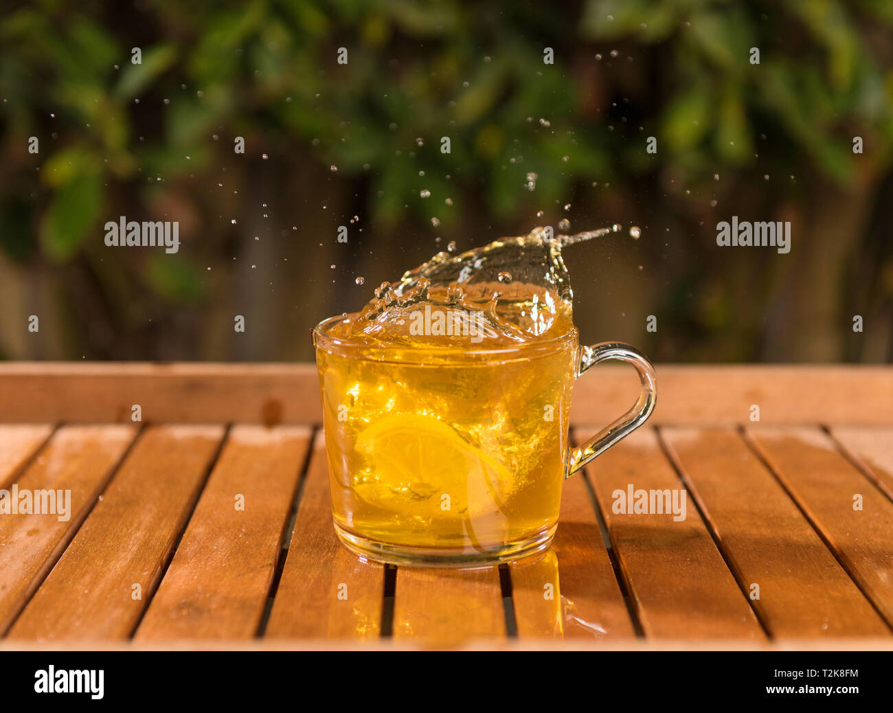 Tea splash in the cup. Splash outdoor. Splash in the cup Stock Photo ...