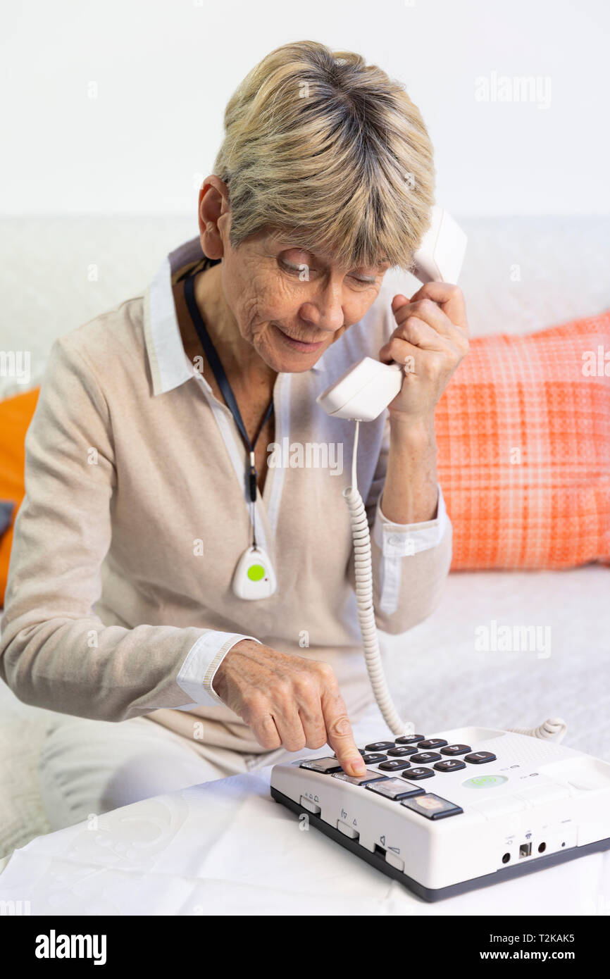 Alarm for senior woman hi-res stock photography and images - Alamy