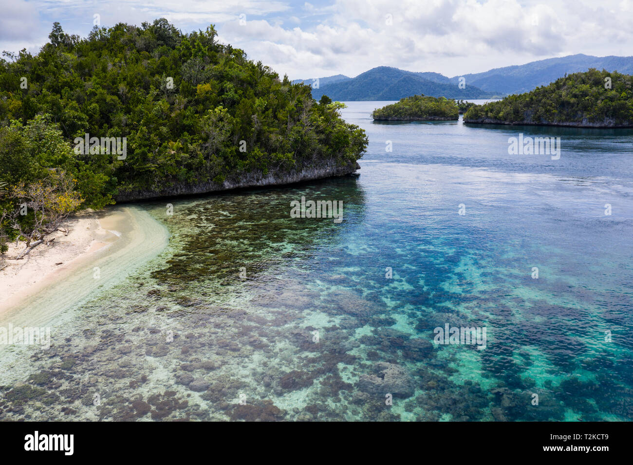 Limestone islands, surrounded by coral reefs, lie scattered throughout ...