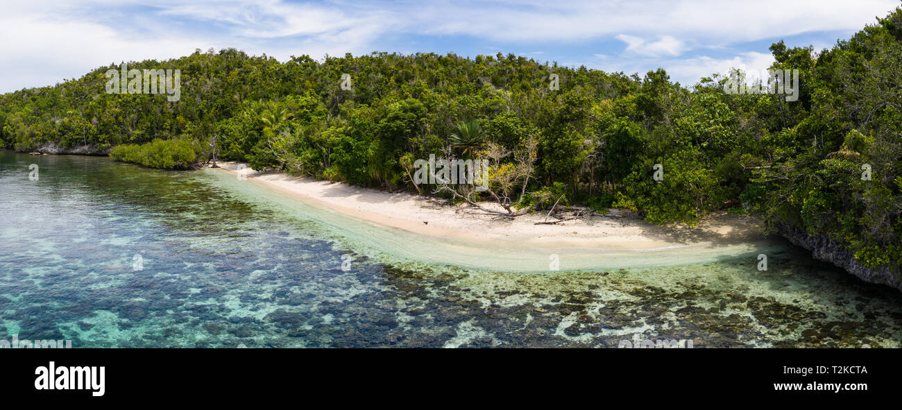 Limestone islands, surrounded by coral reefs, lie scattered throughout ...