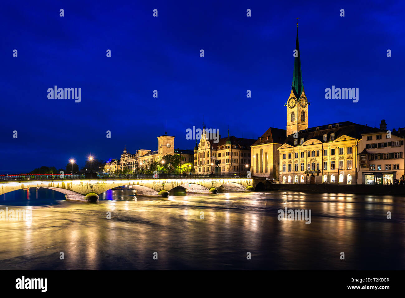 Night view of historic Zurich city center with famous Fraumunster ...
