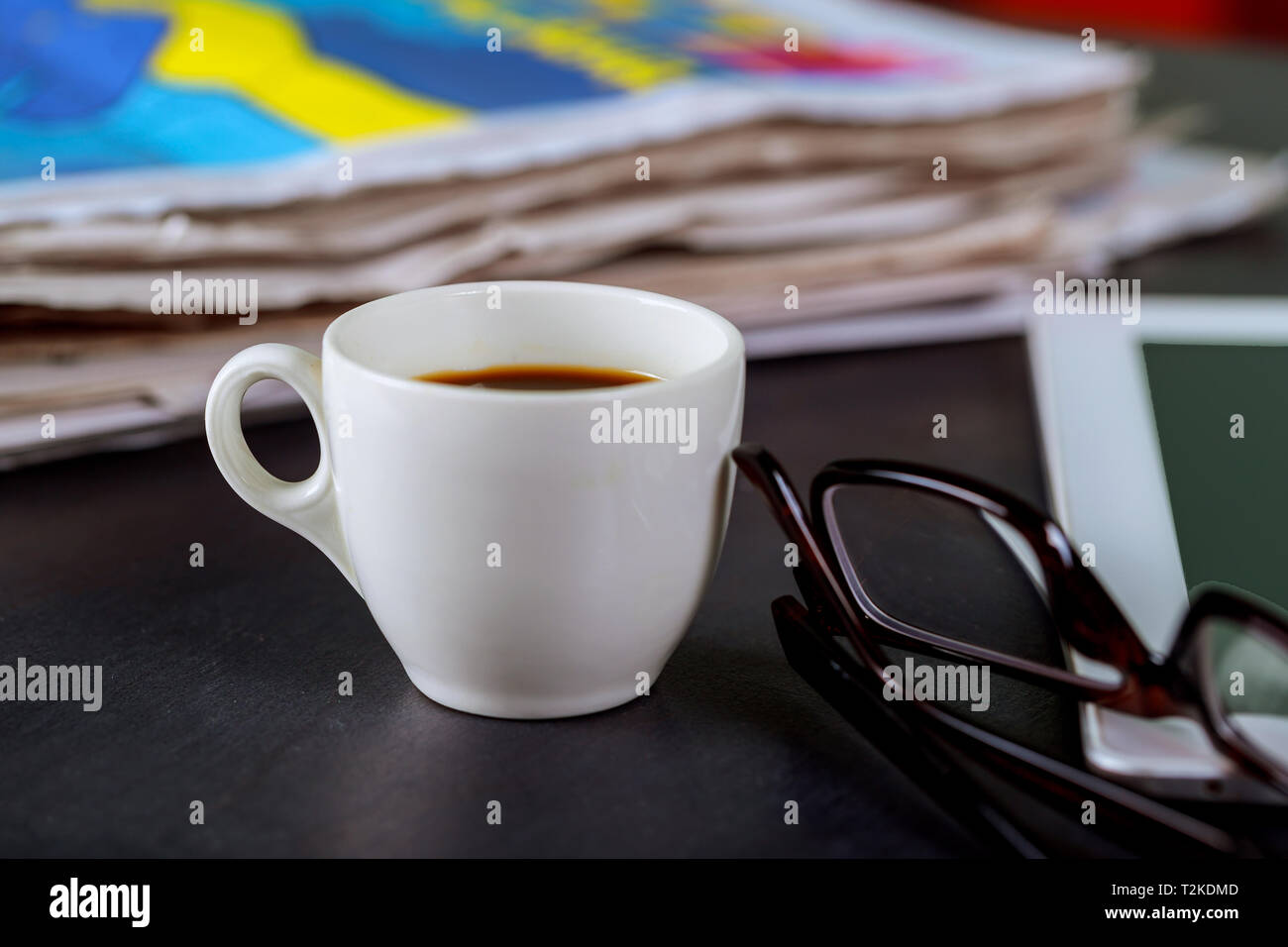 Newspapers coffee cup reading glasses hi-res stock photography and ...
