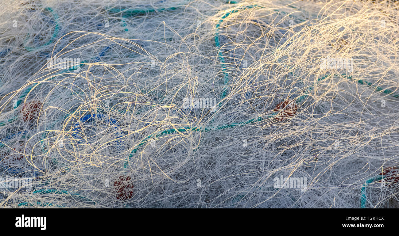 full frame picture showing a tangled fishing net Stock Photo - Alamy