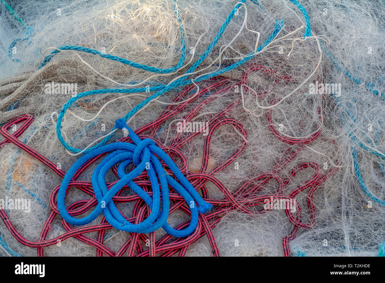 full frame picture showing a tangled fishing net Stock Photo - Alamy