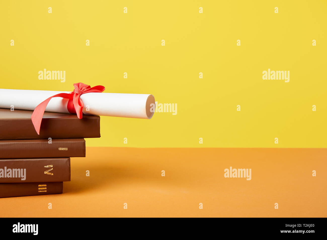 Orange diploma hi-res stock photography and images - Alamy