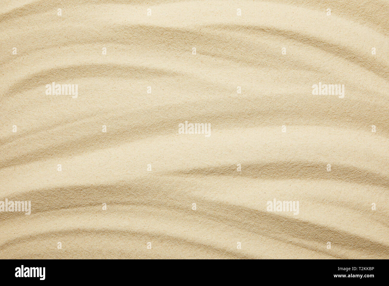 golden and textured sandy surface on beach in summertime Stock Photo ...
