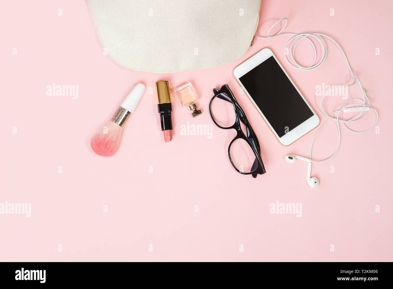 Top view female accessories: cosmetics, glasses, mobile phone ...