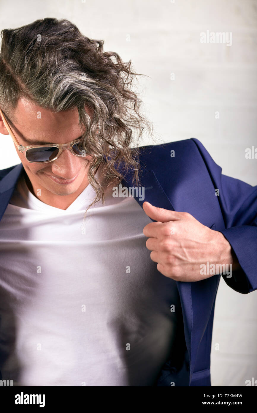 Worker putting on a jacket hi-res stock photography and images - Alamy