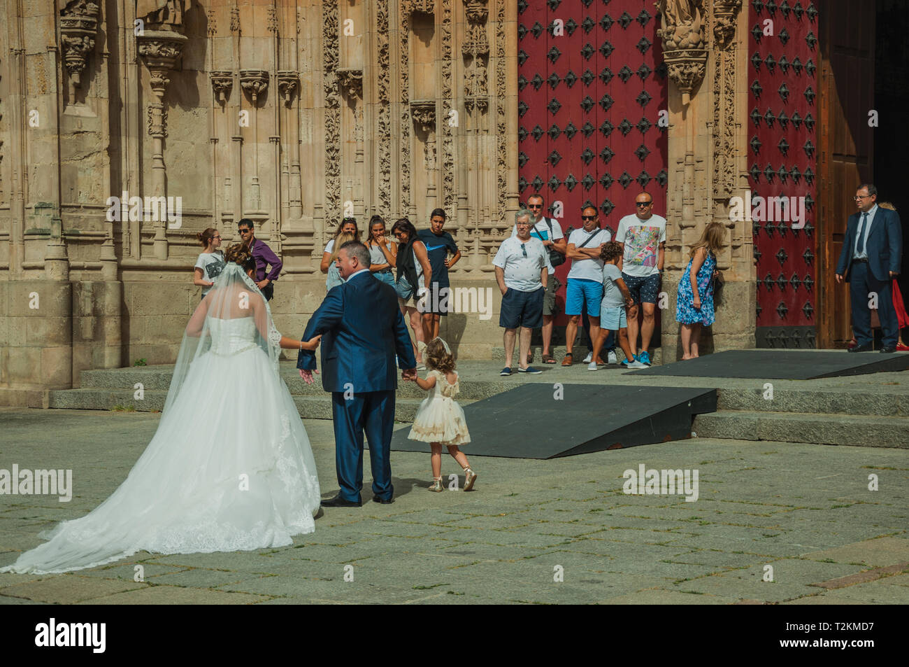 People looking the bride enter through the door of the New Cathedral at ...