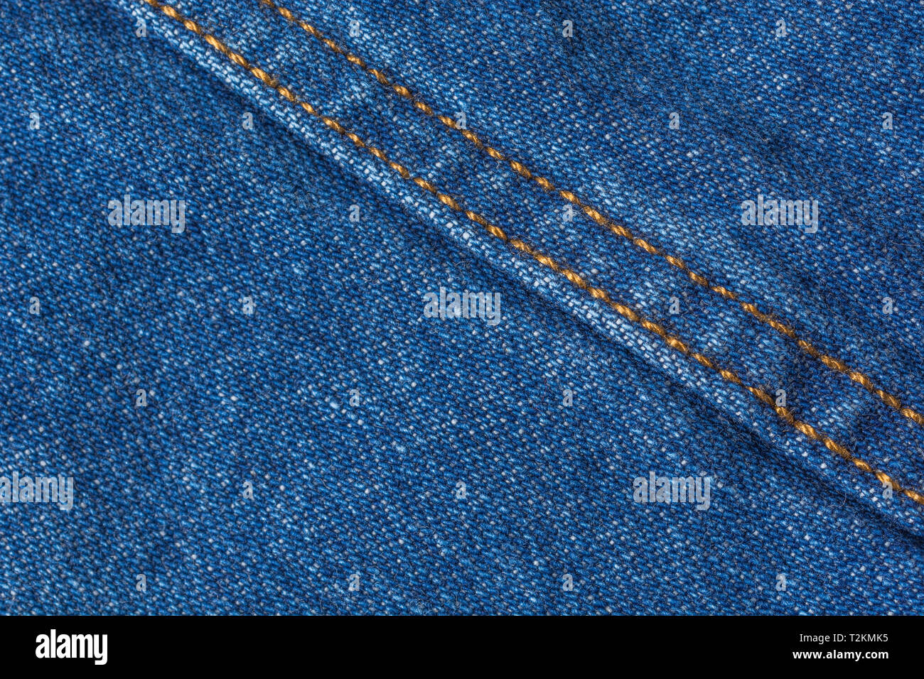 Close-up of blue denim fabric, showing warp and weft pattern thread ...