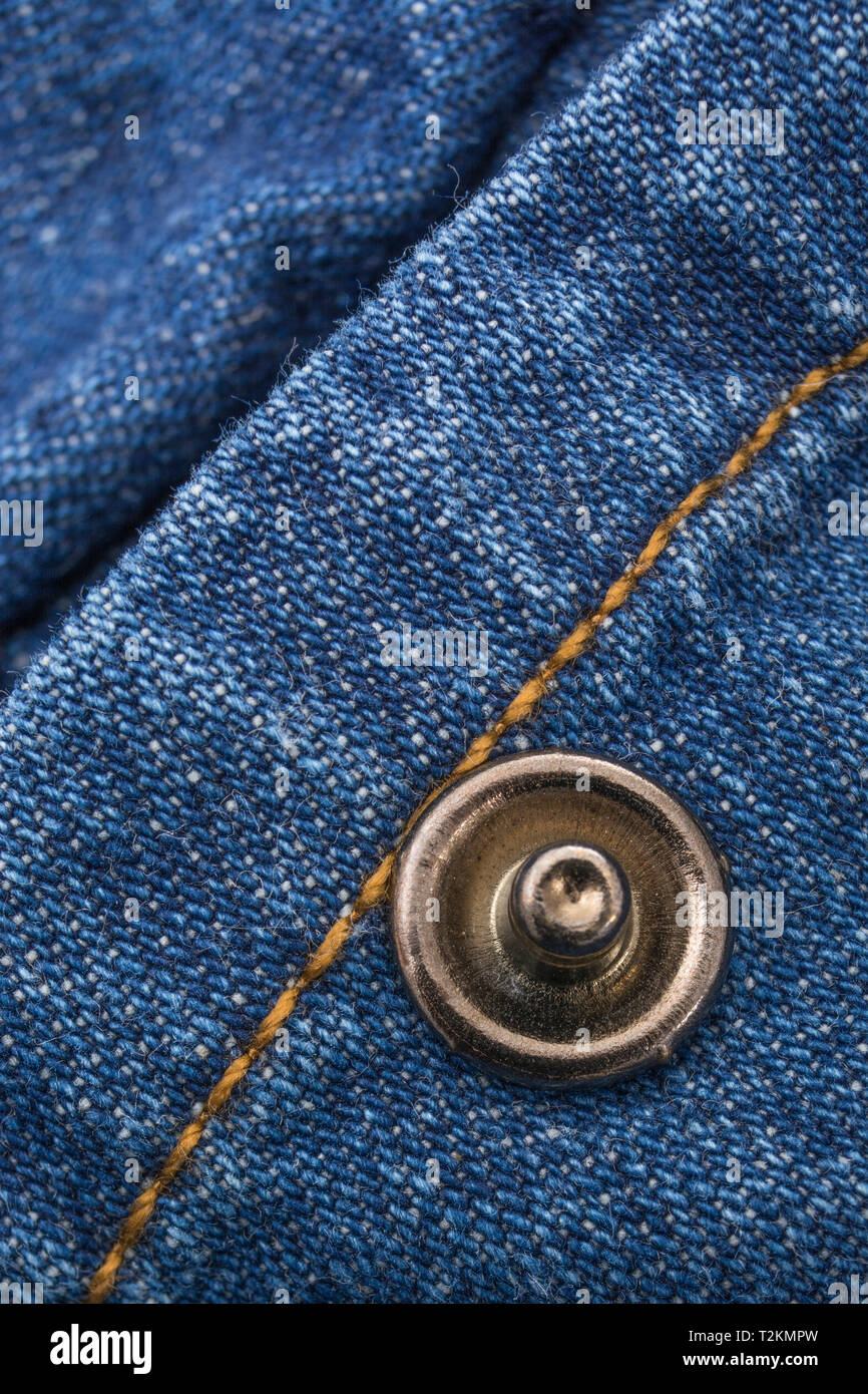 Close-up of blue denim fabric, showing warp and weft pattern thread ...