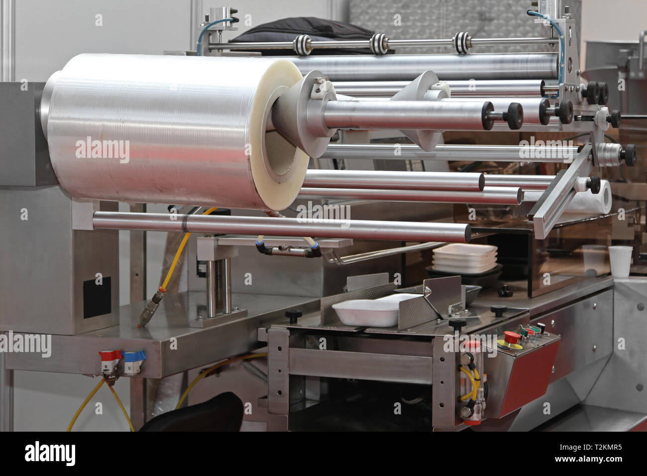 Foil Packing Machine at Production Line in Food Factory Stock Photo - Alamy