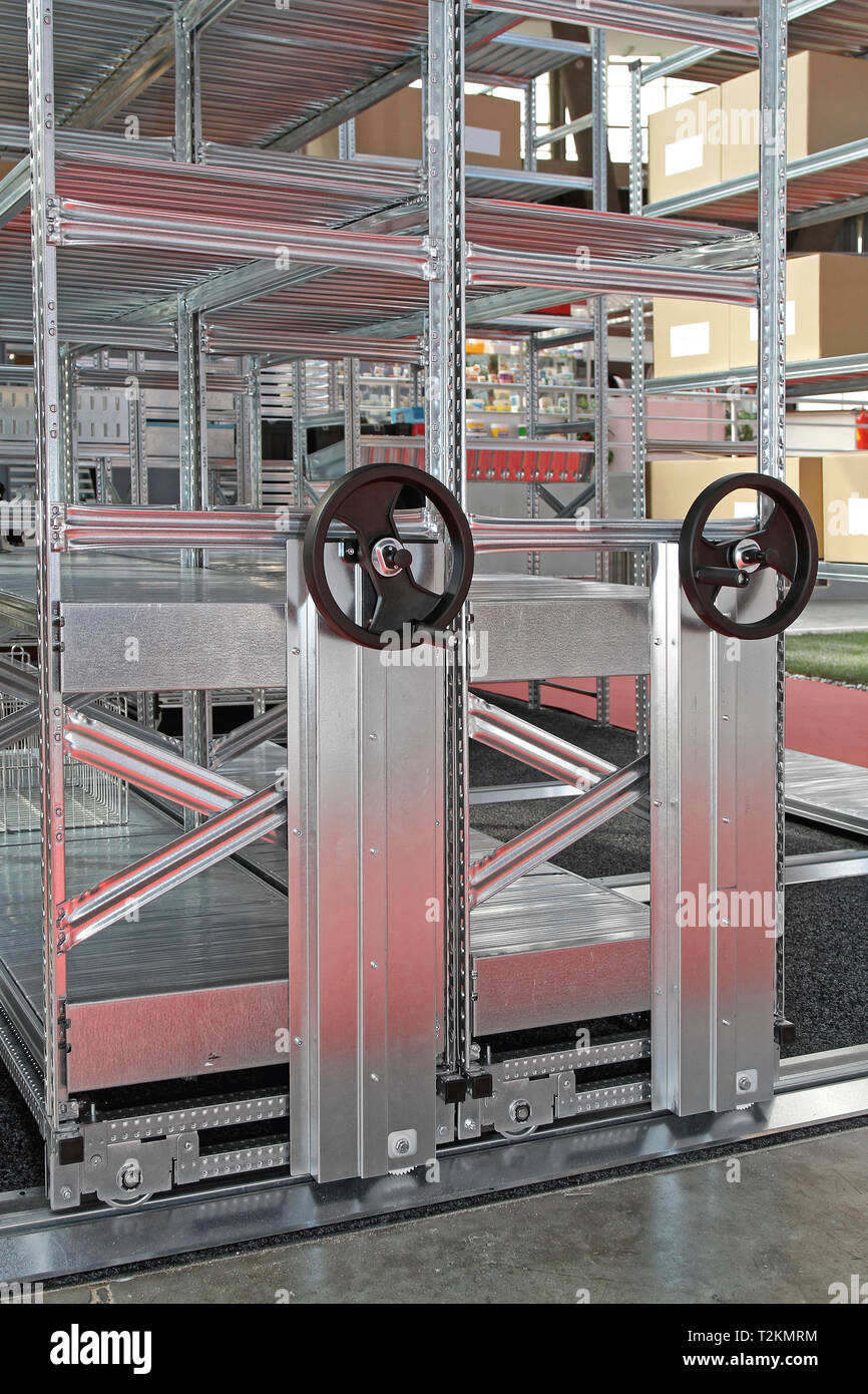 Hand crank movable metal shelving system in storage room hi-res stock ...