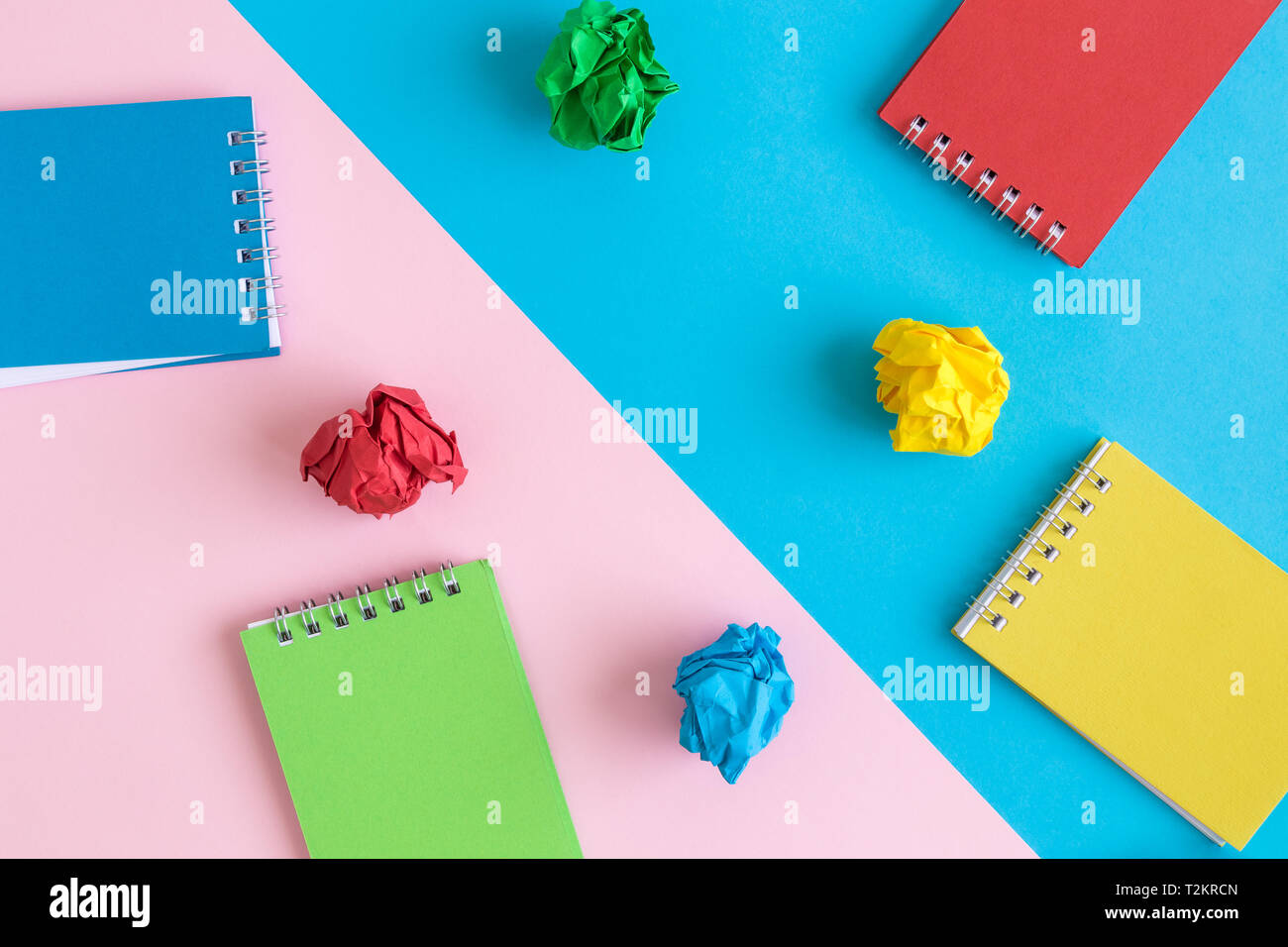 Flat lay of multicolored notepads and crushed paper abstract Stock ...