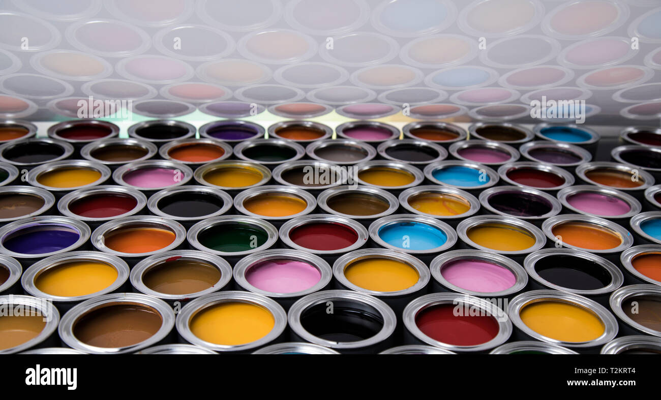 Collection of colored paints cans Stock Photo - Alamy