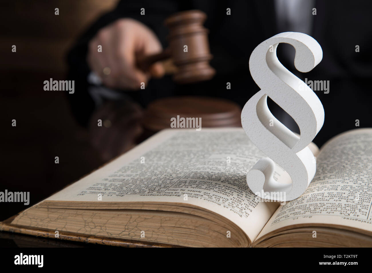 Paragraph, Judge hold hammer on wooden table Stock Photo - Alamy