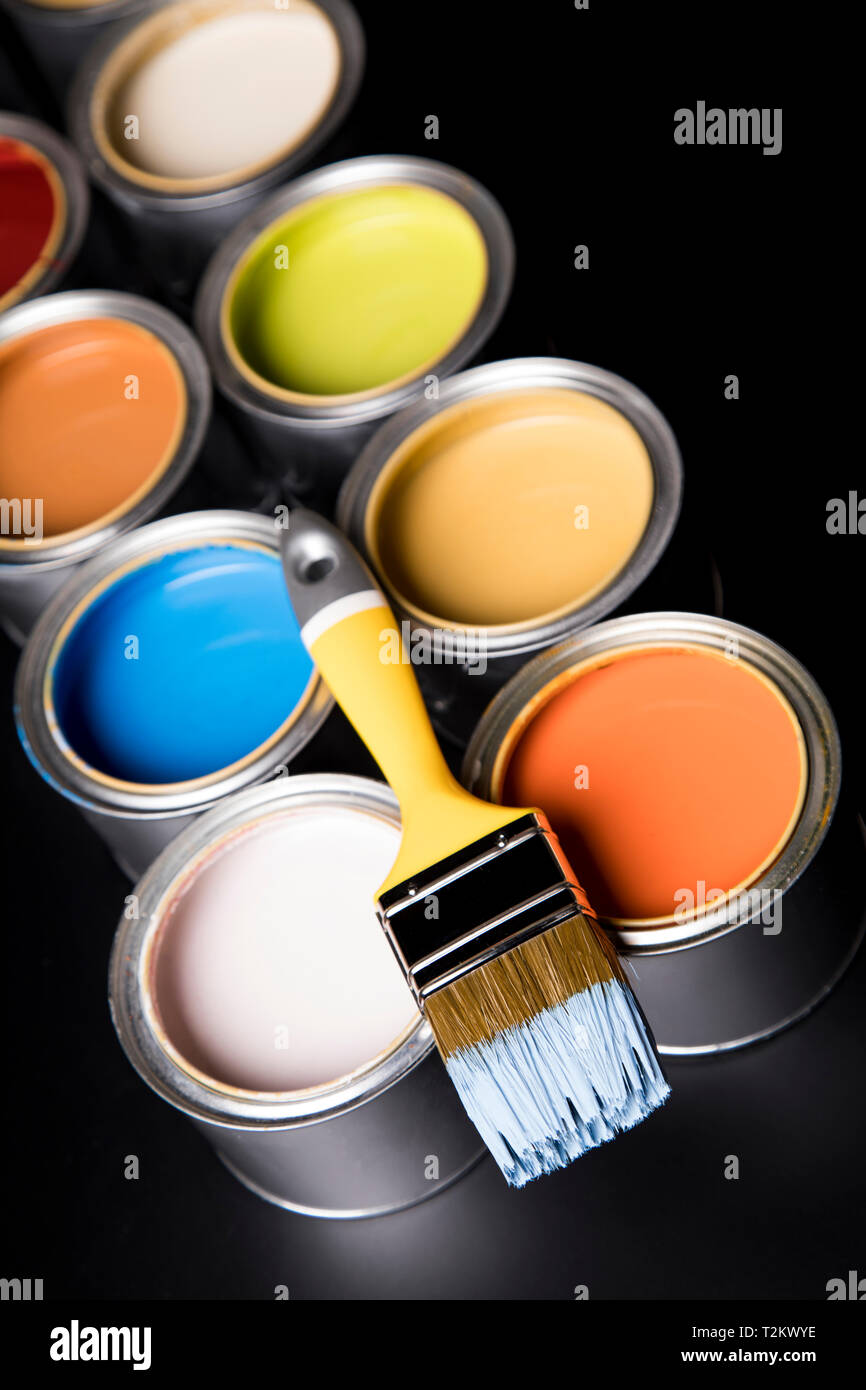 Metal tin cans with color paint and paintbrush Stock Photo - Alamy