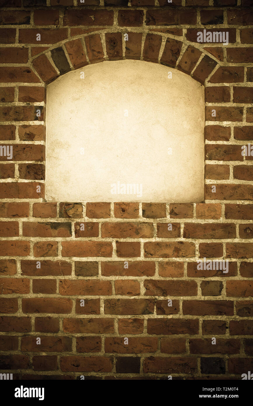 Old stone arch arc niche with space for text frame in brick wall ...