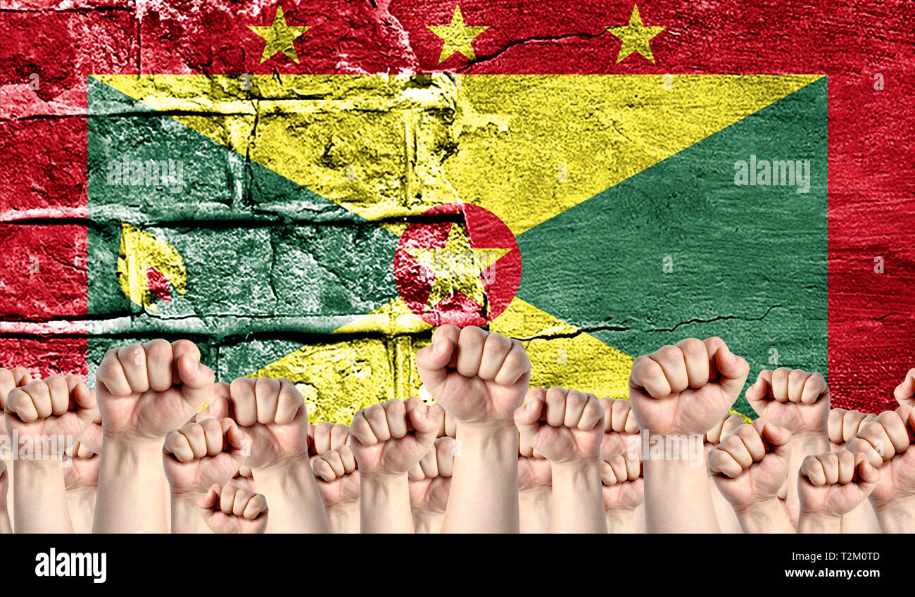 Male hands clenched in a fist raised up against the backdrop of a ...