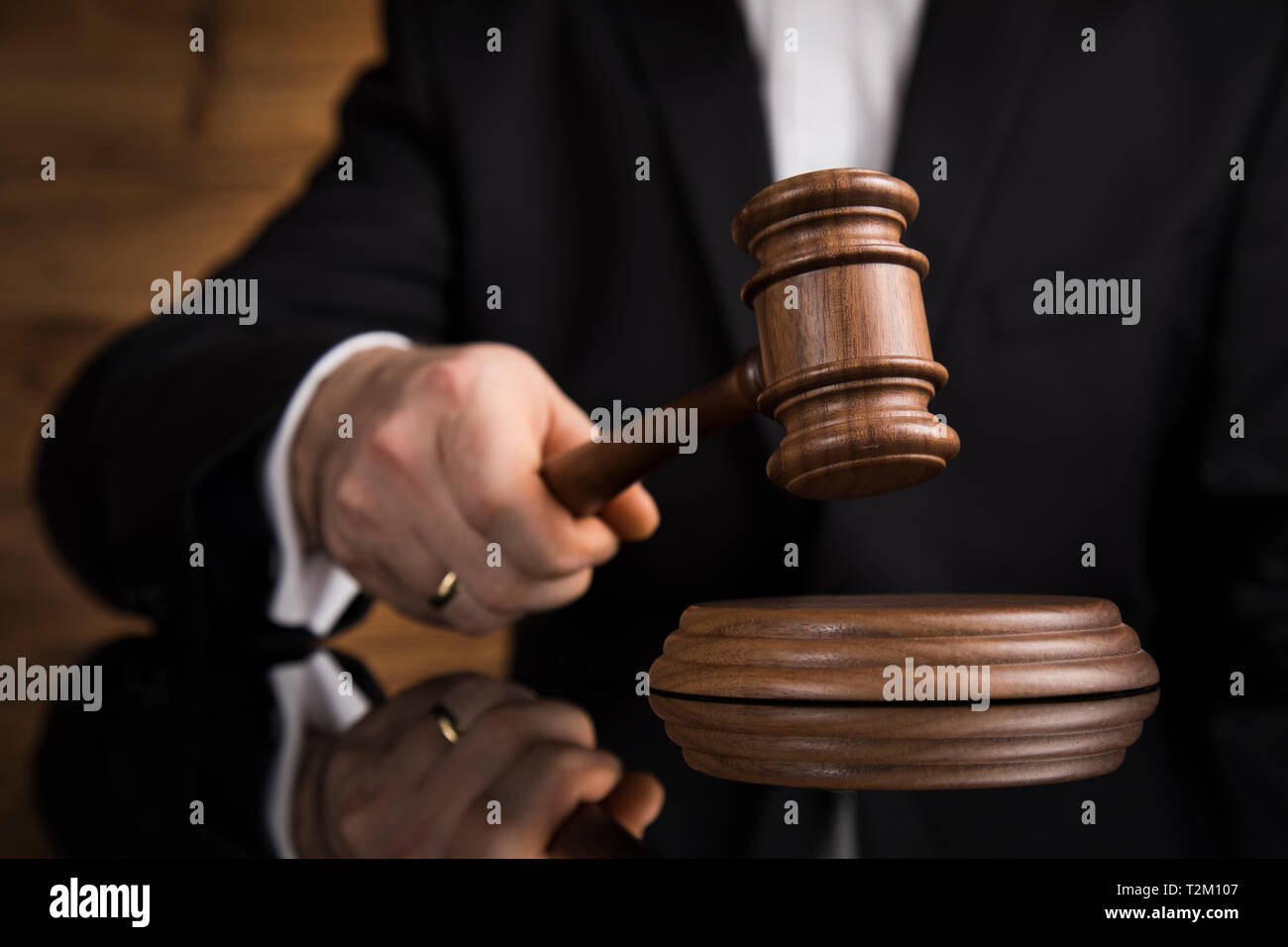 Justice and law concept, Male judge in a courtroom striking the gavel ...