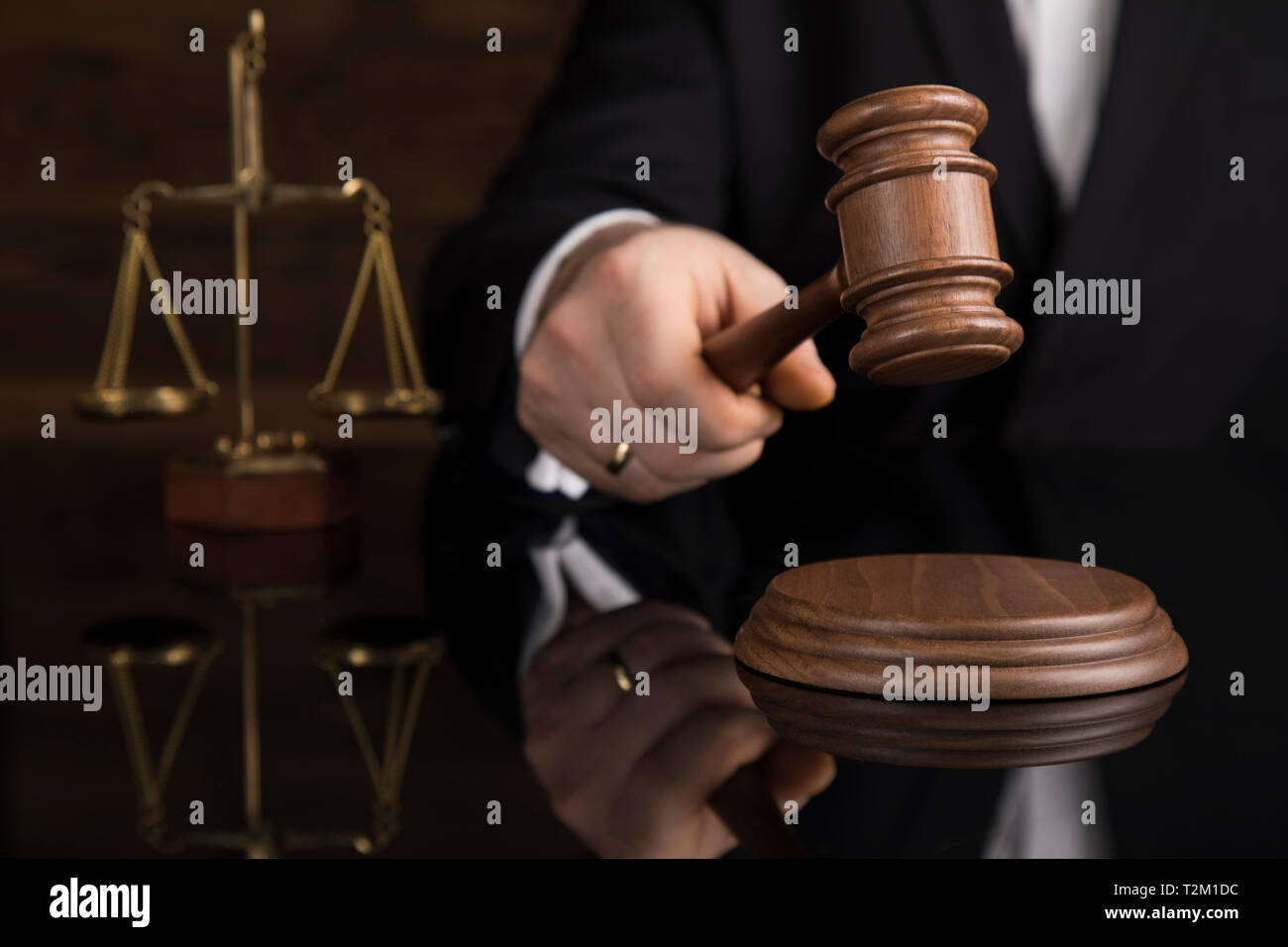 Justice and law concept, Male judge in a courtroom striking the gavel ...