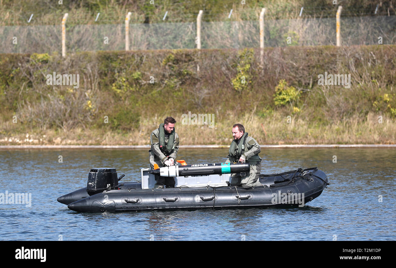 Royal Navy personel demonstrating their underwater Remus drone during a ...