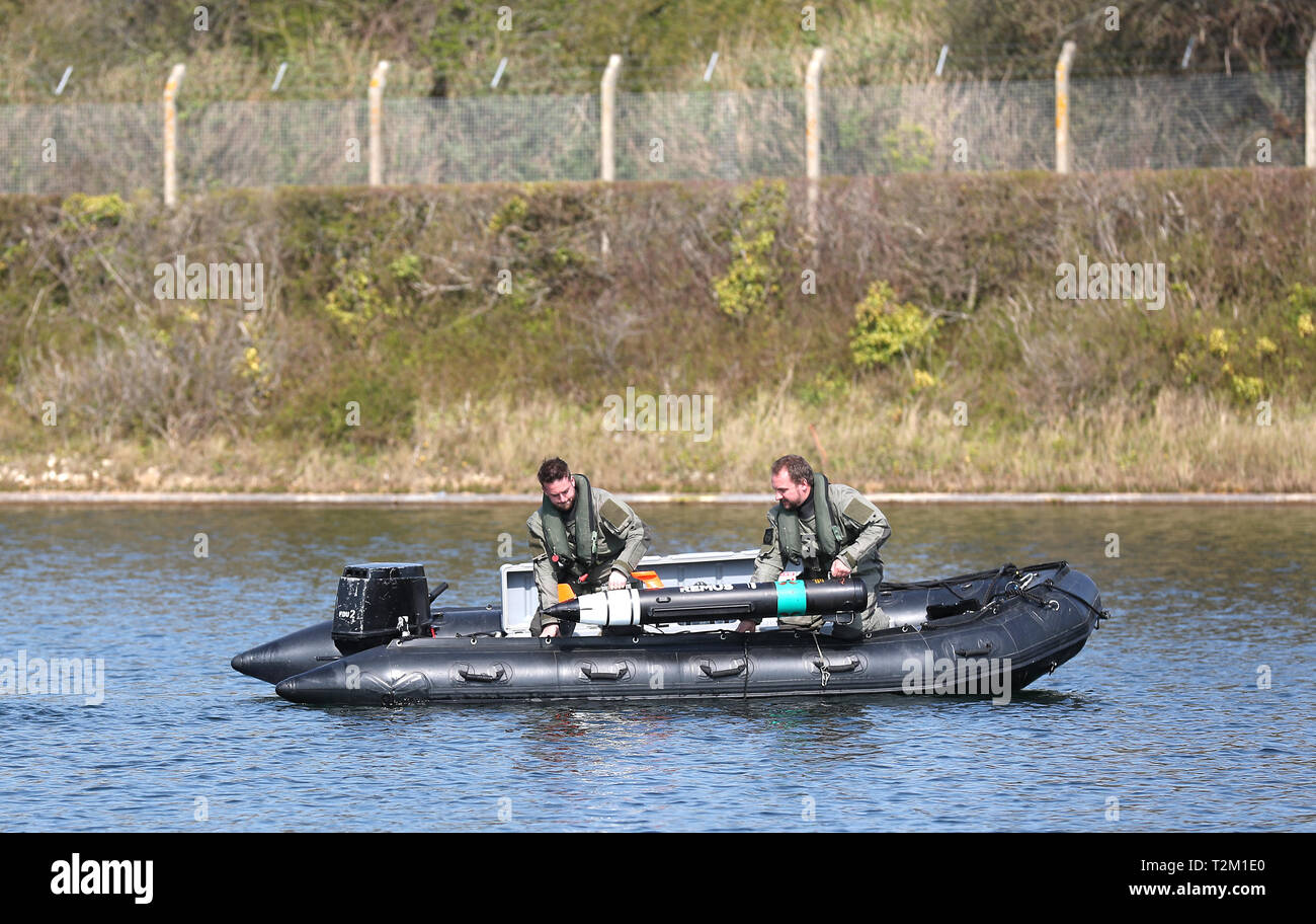 Royal Navy personel demonstrating their underwater Remus drone during a ...
