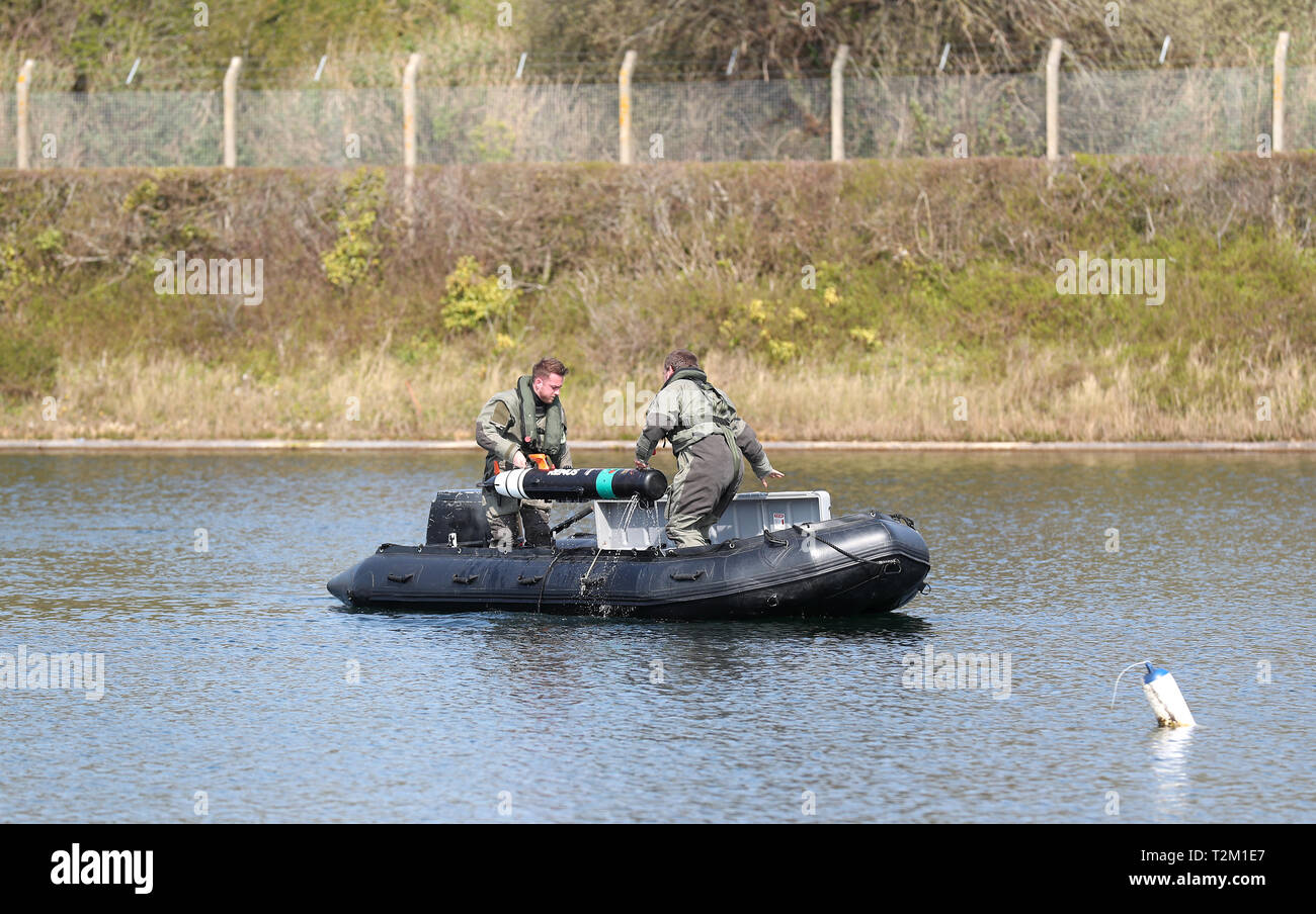 Royal Navy personel demonstrating their underwater Remus drone during a ...