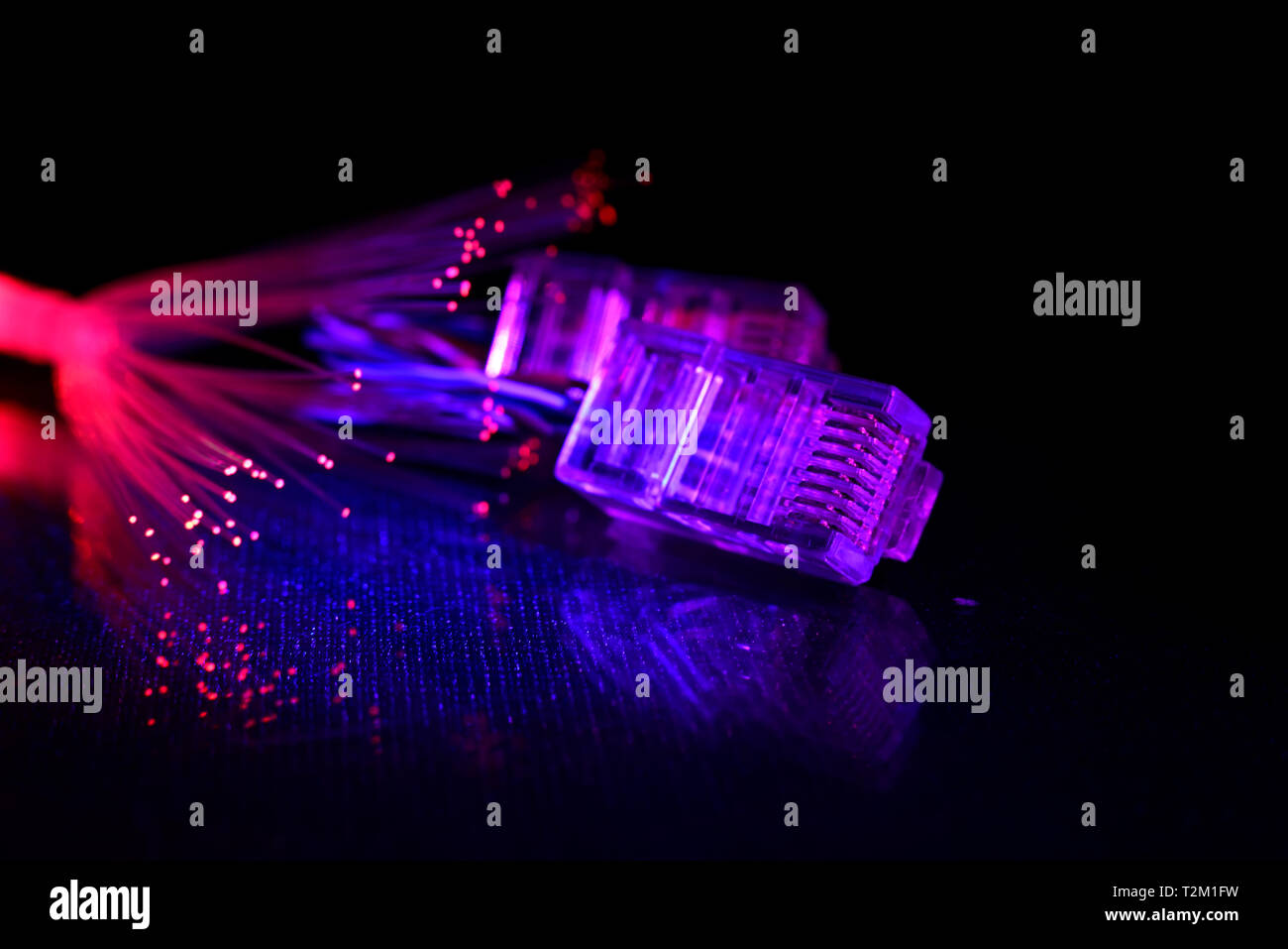 Network cable with fiber optics light on black background Stock Photo ...