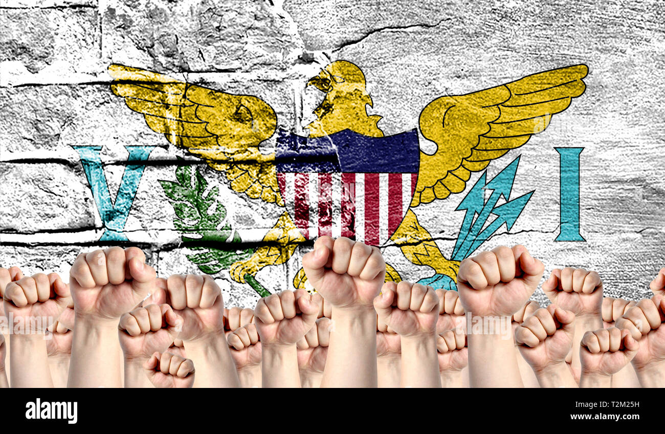 Male hands clenched in a fist raised up against the backdrop of a ...