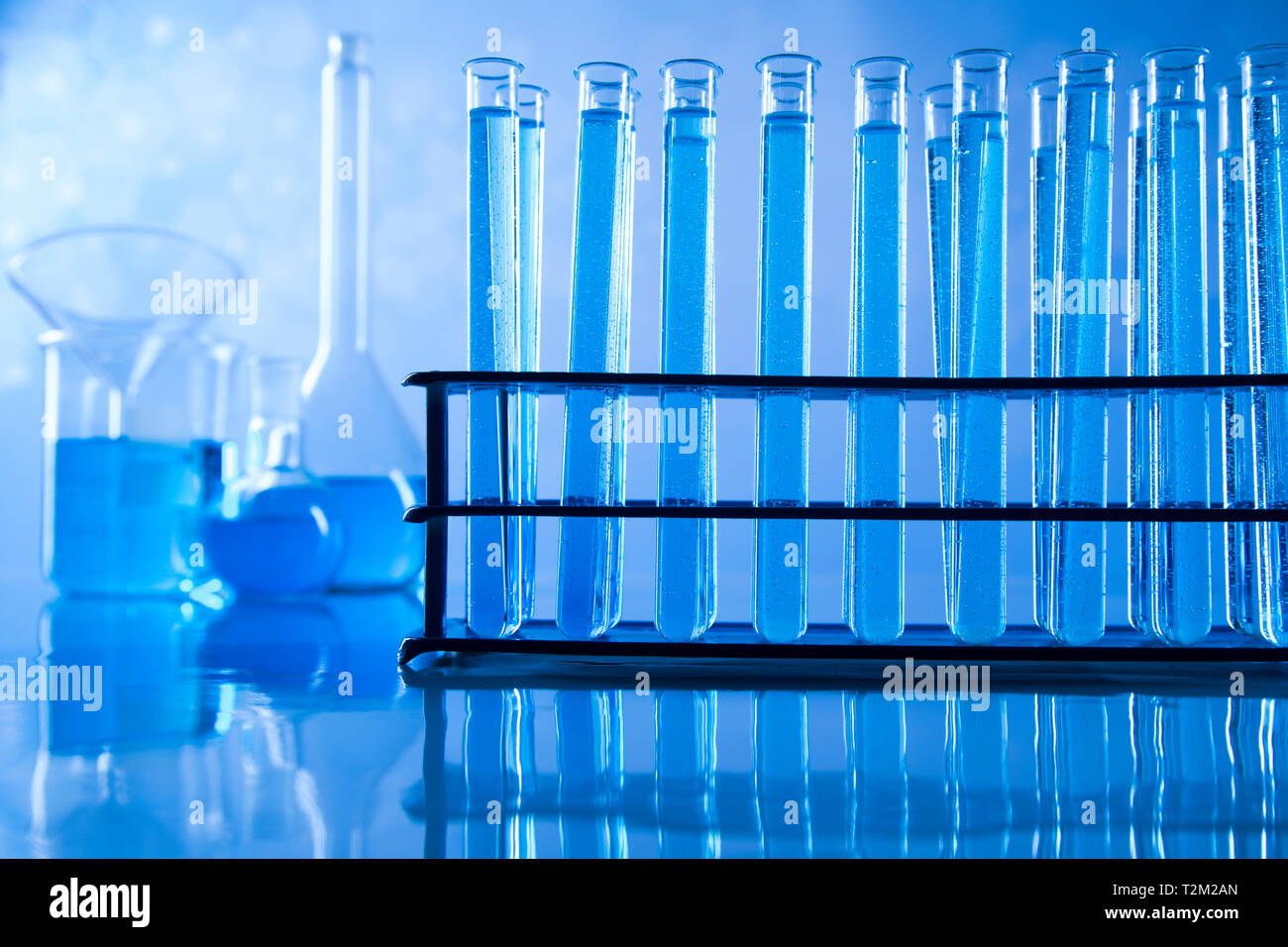 Laboratory beakers,Science experiment, blue background Stock Photo - Alamy