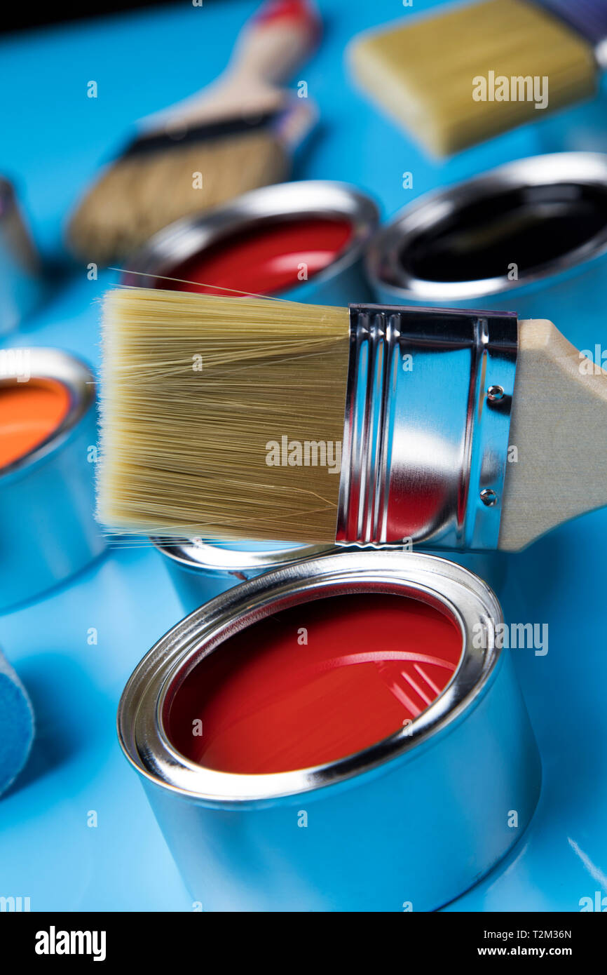 Metal tin cans with color paint and paintbrush Stock Photo - Alamy