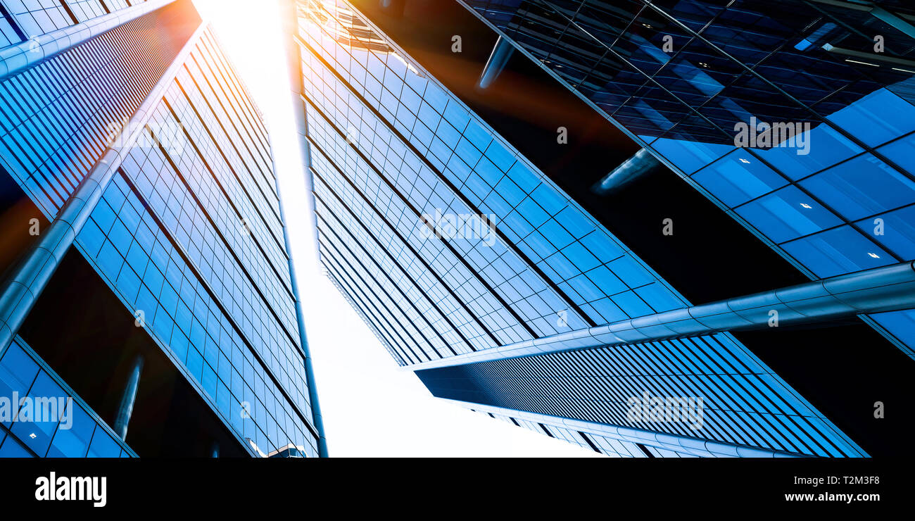 Bottom angle view of glass blue building Stock Photo - Alamy