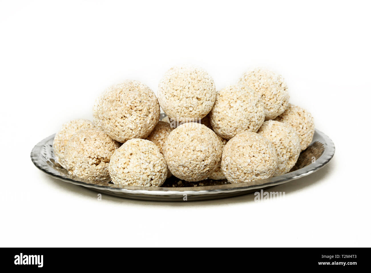 Picture of cholai ke ladoo in the plate. Isolated on the white ...