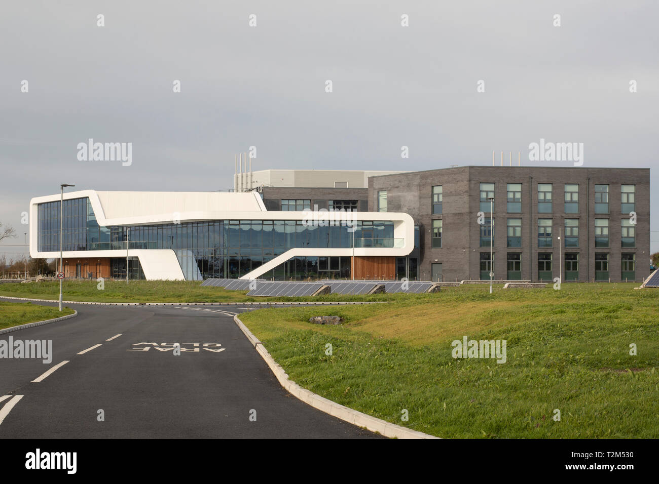 Wide view of front facade from entrance to park. Menai Science Parc ...