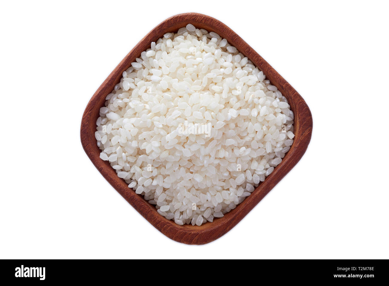 Raw uncooked sushi rice in wooden bowl isolated on white background ...